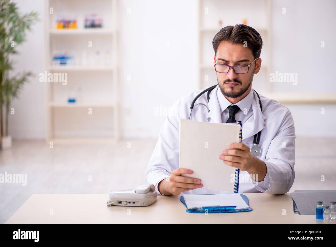 Young male doctor working at the hospital Stock Photo - Alamy