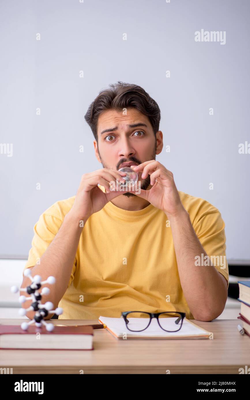 Young student in happy idea concept in the classroom Stock Photo - Alamy