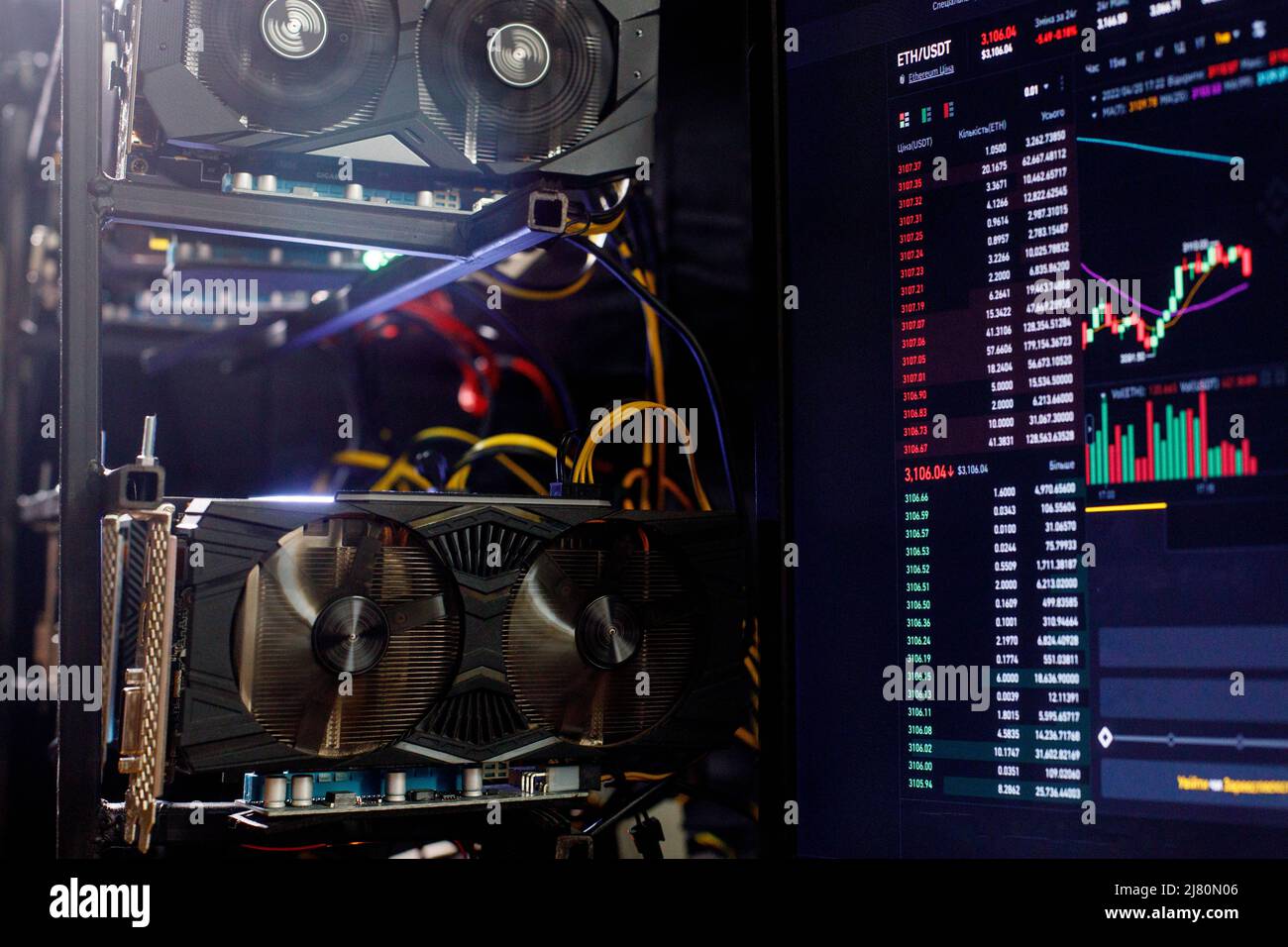 Graphics cards in rig for ethereum mining farm on background Stock ...
