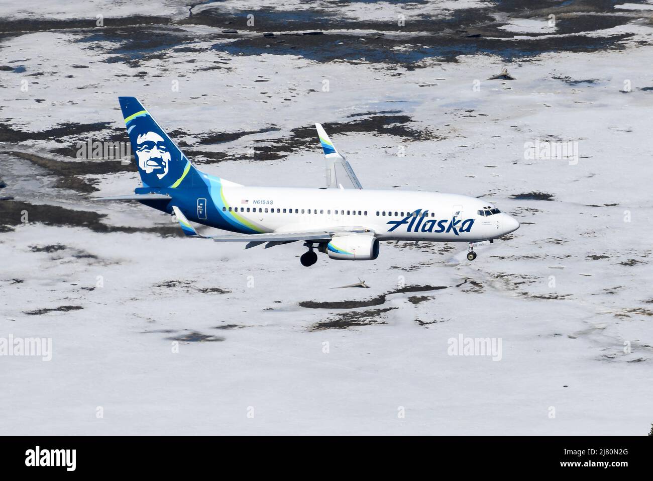 Alaska Airlines Boeing 737 plane flying ver snow in Alaska. Aircraft ... Alaska Airlines Boeing 737 plane flying ver snow in Alaska. Aircraft ...