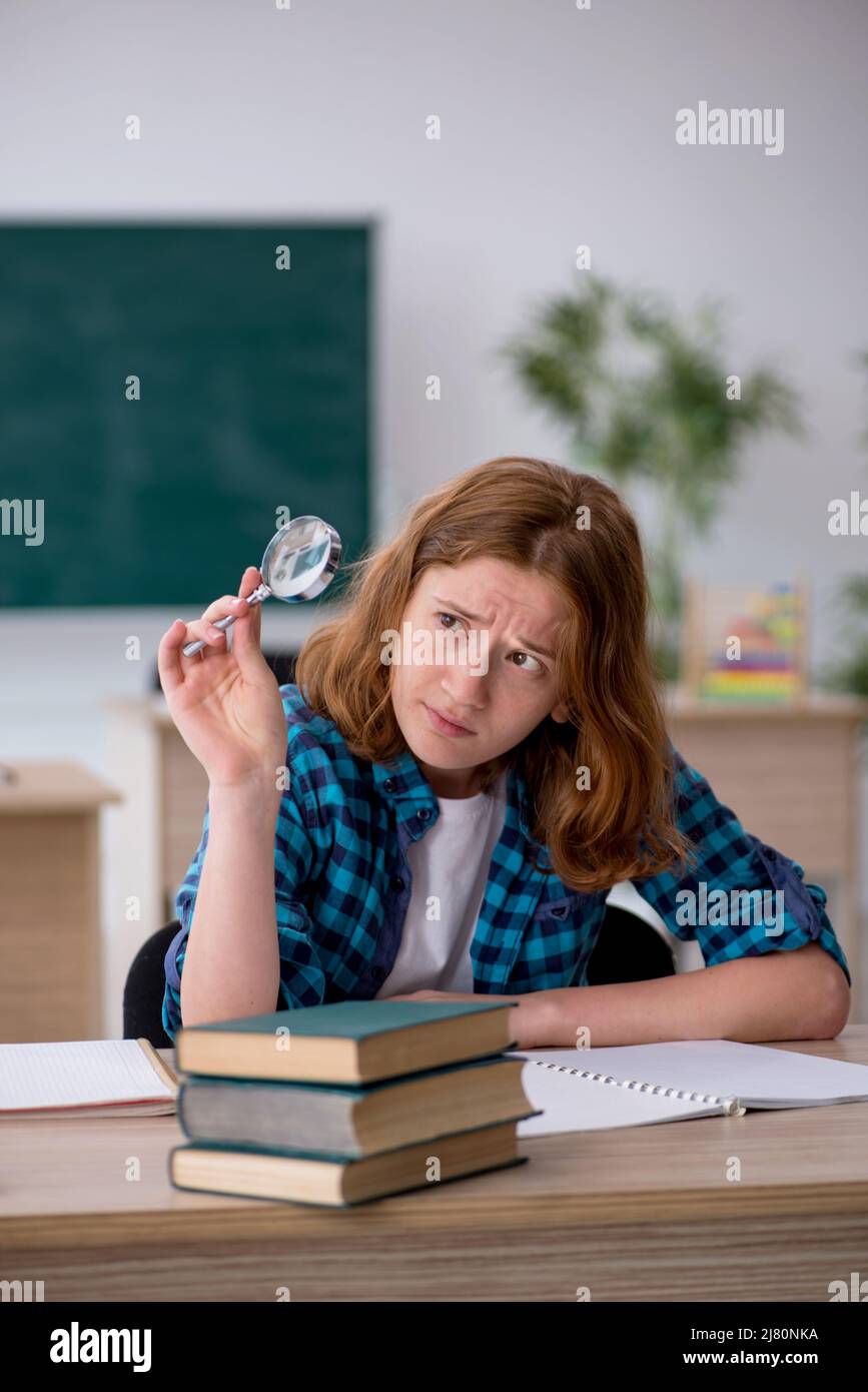 Female student preparing for exams in the classroom Stock Photo - Alamy