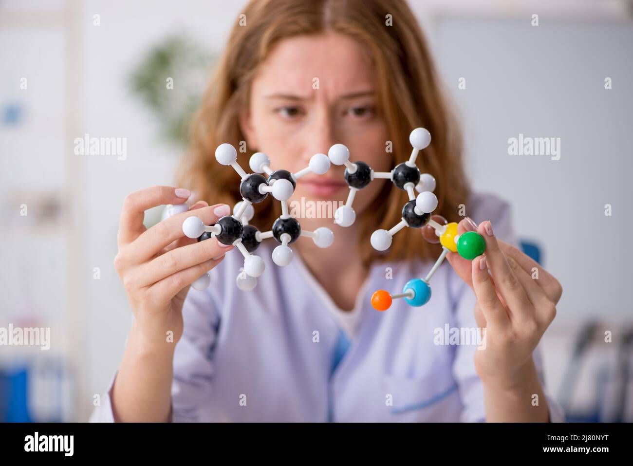 Female scientist studying molecular model hi-res stock photography and ...