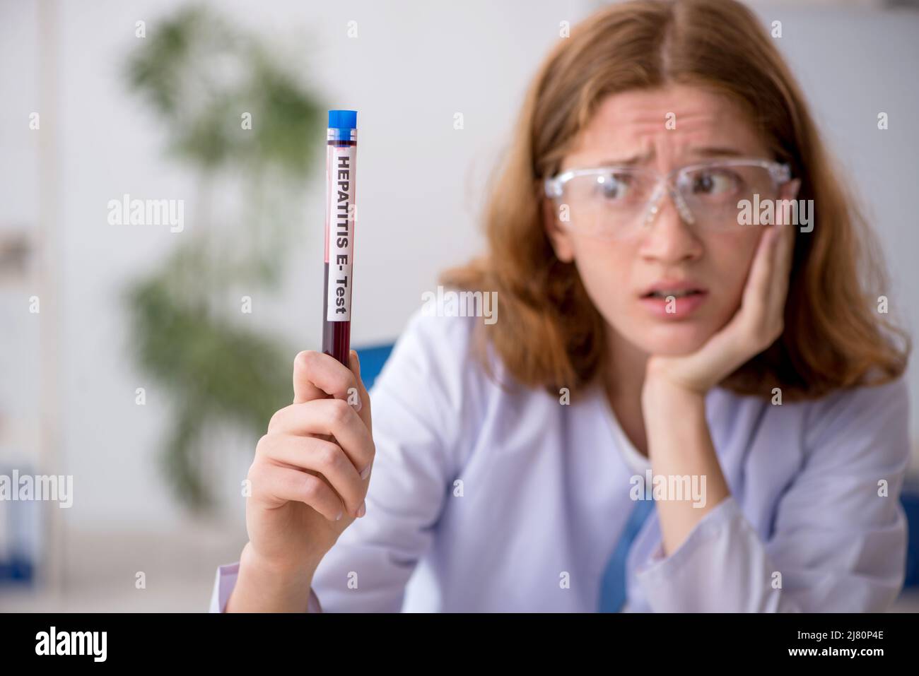 Young girl hematologist working at the lab Stock Photo - Alamy