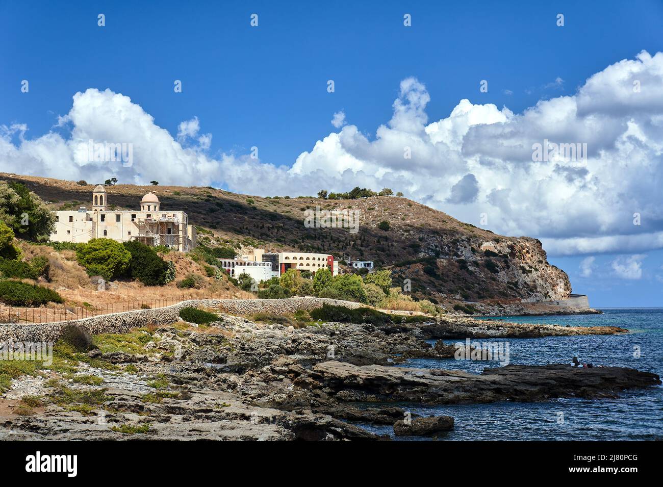 stone buildings of orthodox monastery on the sea on the island of Crete ...