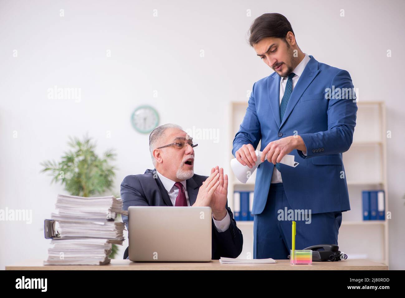 Two employees in dismissal concept Stock Photo - Alamy