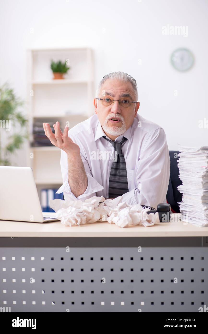 Old businessman employee in brainstorming concept Stock Photo - Alamy