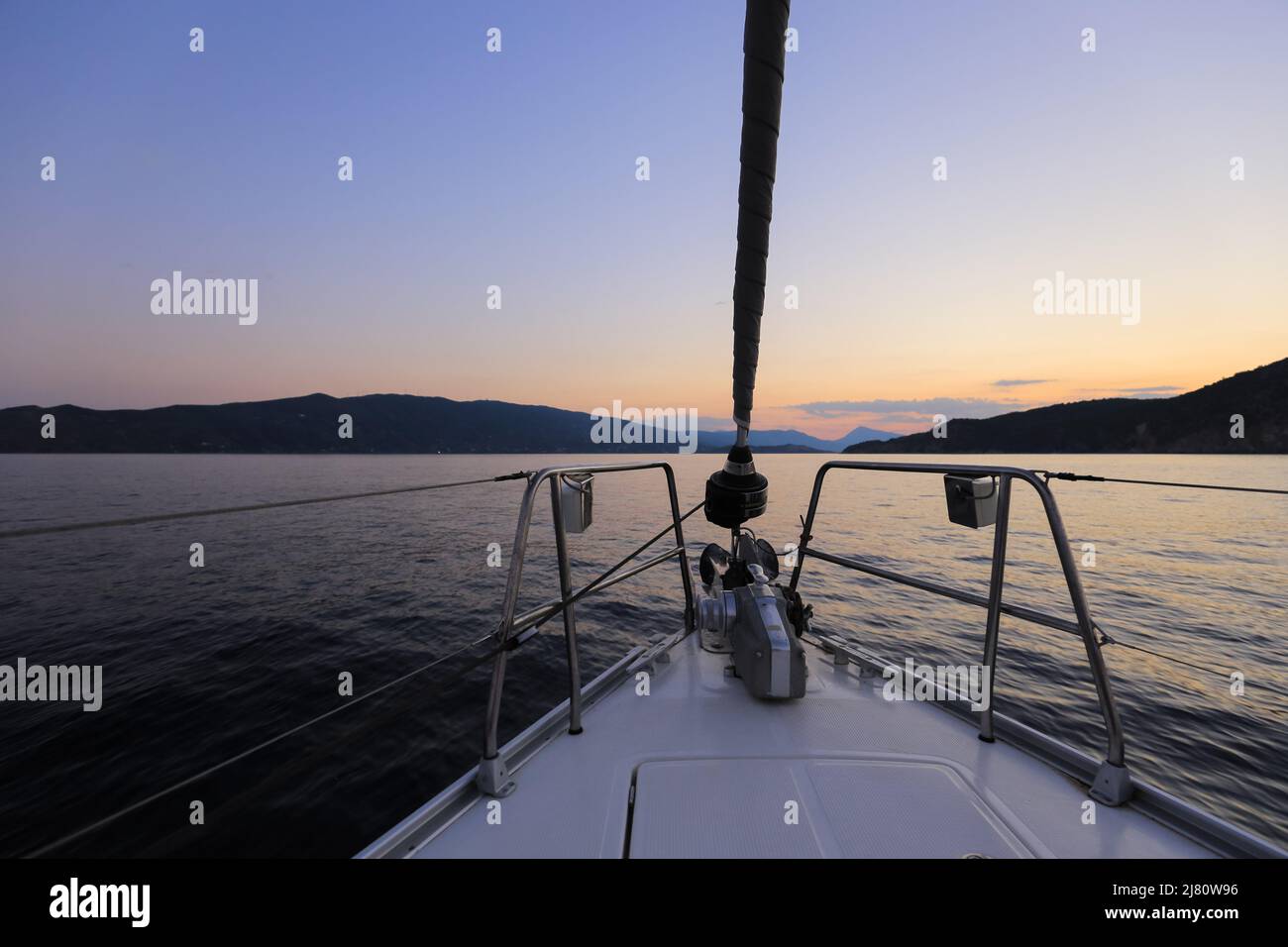 Bow of sailing yacht, view from the sailboat at sunset Stock Photo - Alamy