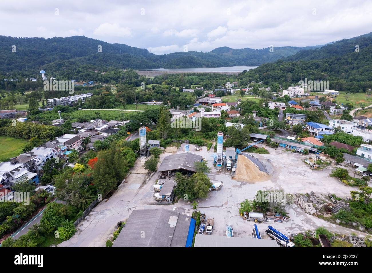 Aerial view top down of Visible cement storage towers and concrete ...