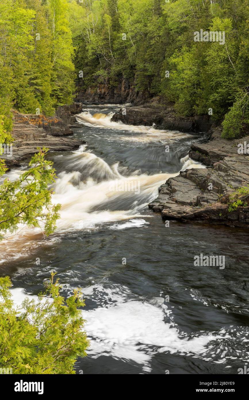 A scenic river with cascades and rapids in the woods Stock Photo - Alamy