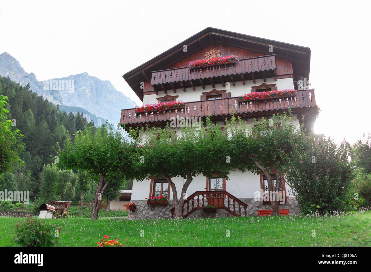 Alpine cottage with wooden balcony . Residential house in the mountains ...