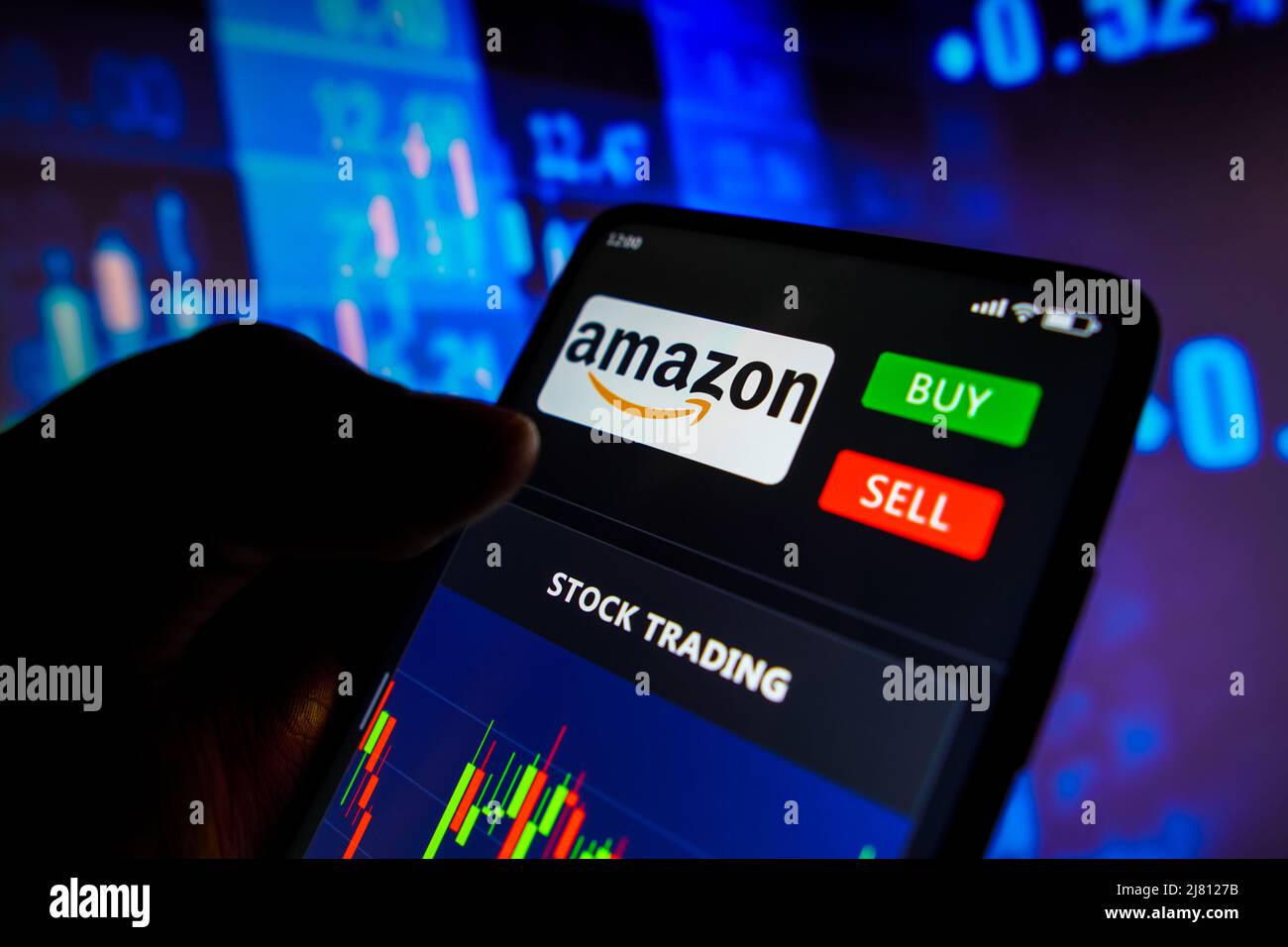 In this photo illustration the stock trading graph of Amazon seen on a ...