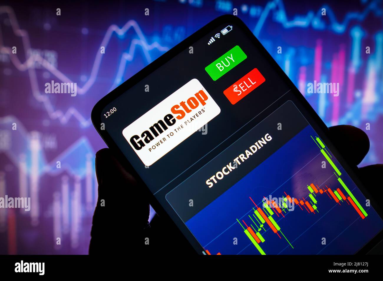 In this photo illustration the stock trading graph of GameStop seen on ...