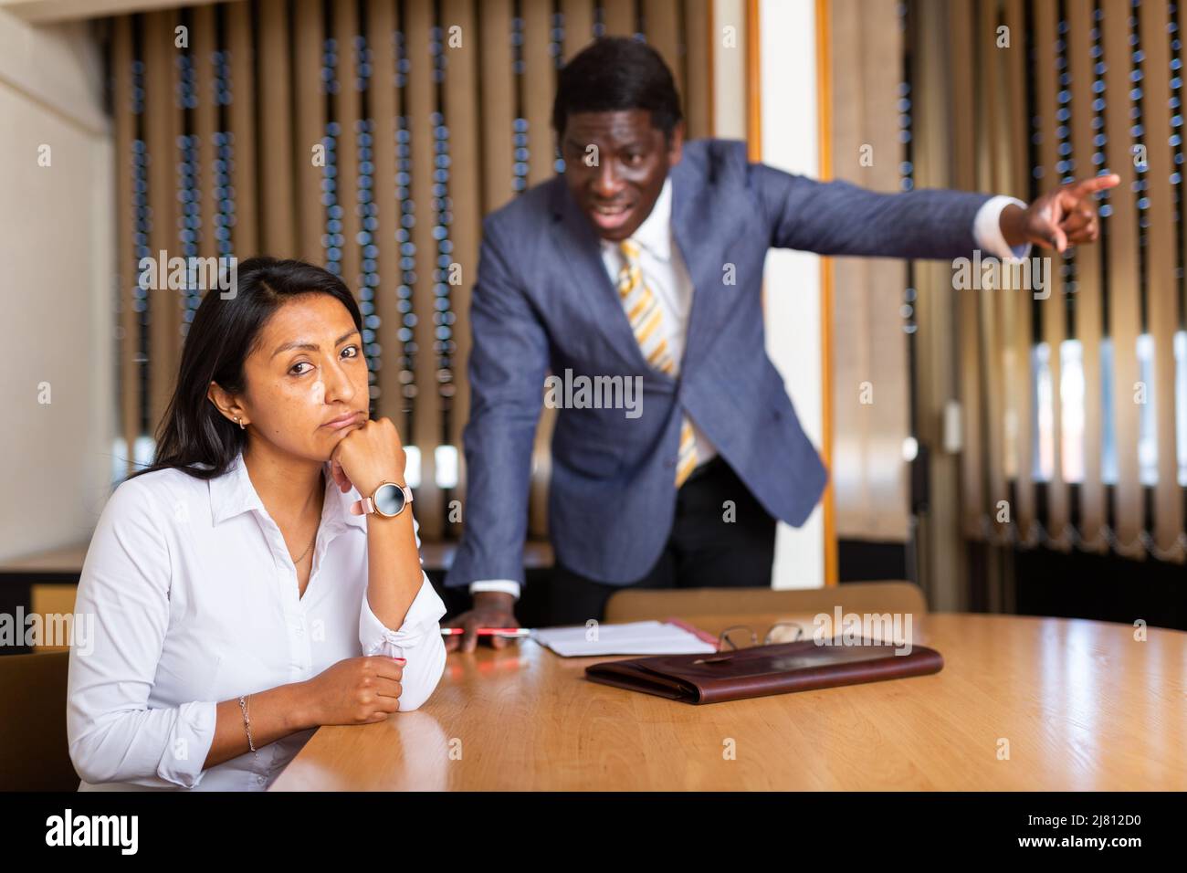 Angry boss blowing up female subordinate for mistakes Stock Photo - Alamy