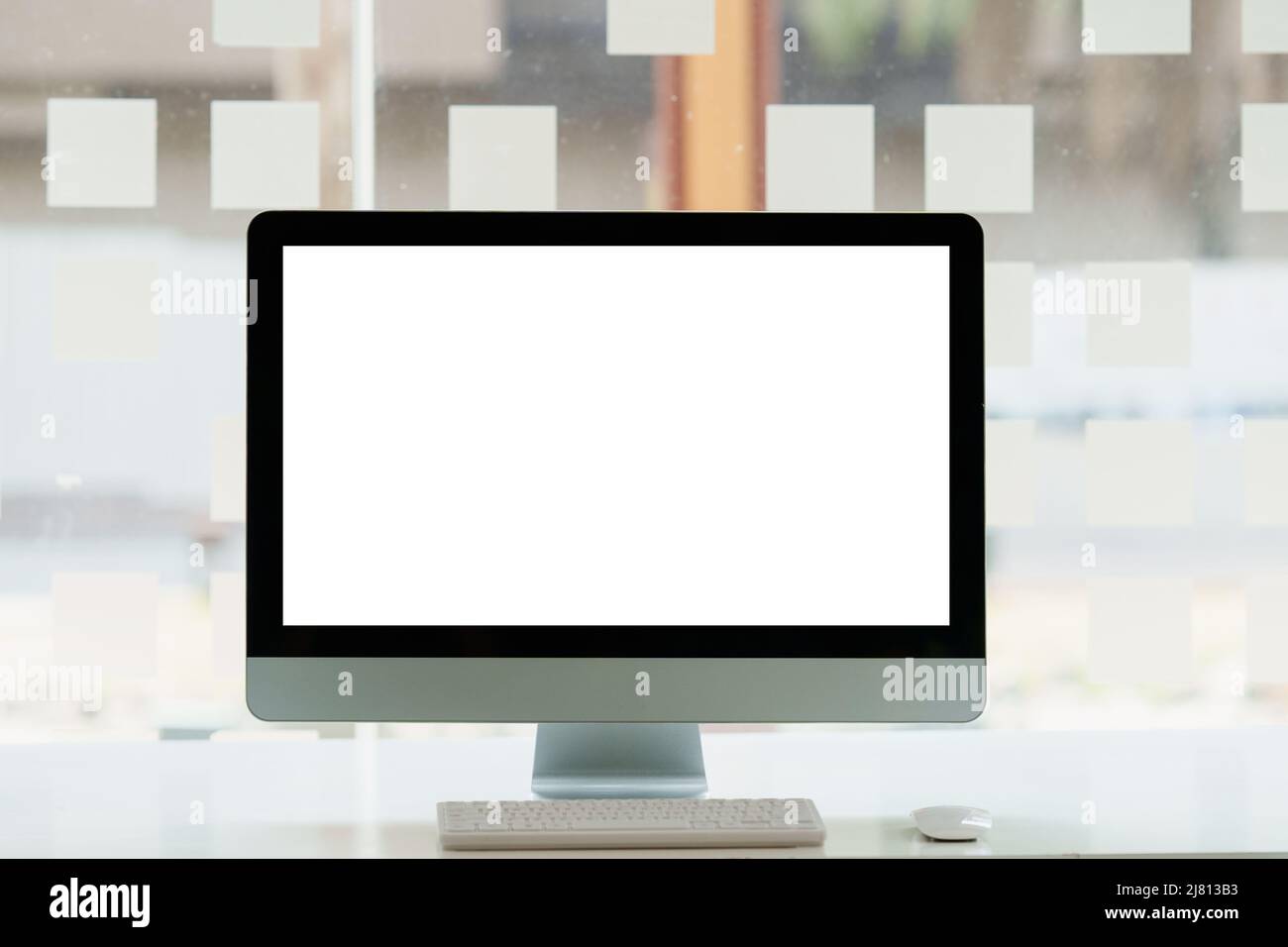 Front view of Mock up desktop computer with blank screen on desk at ...