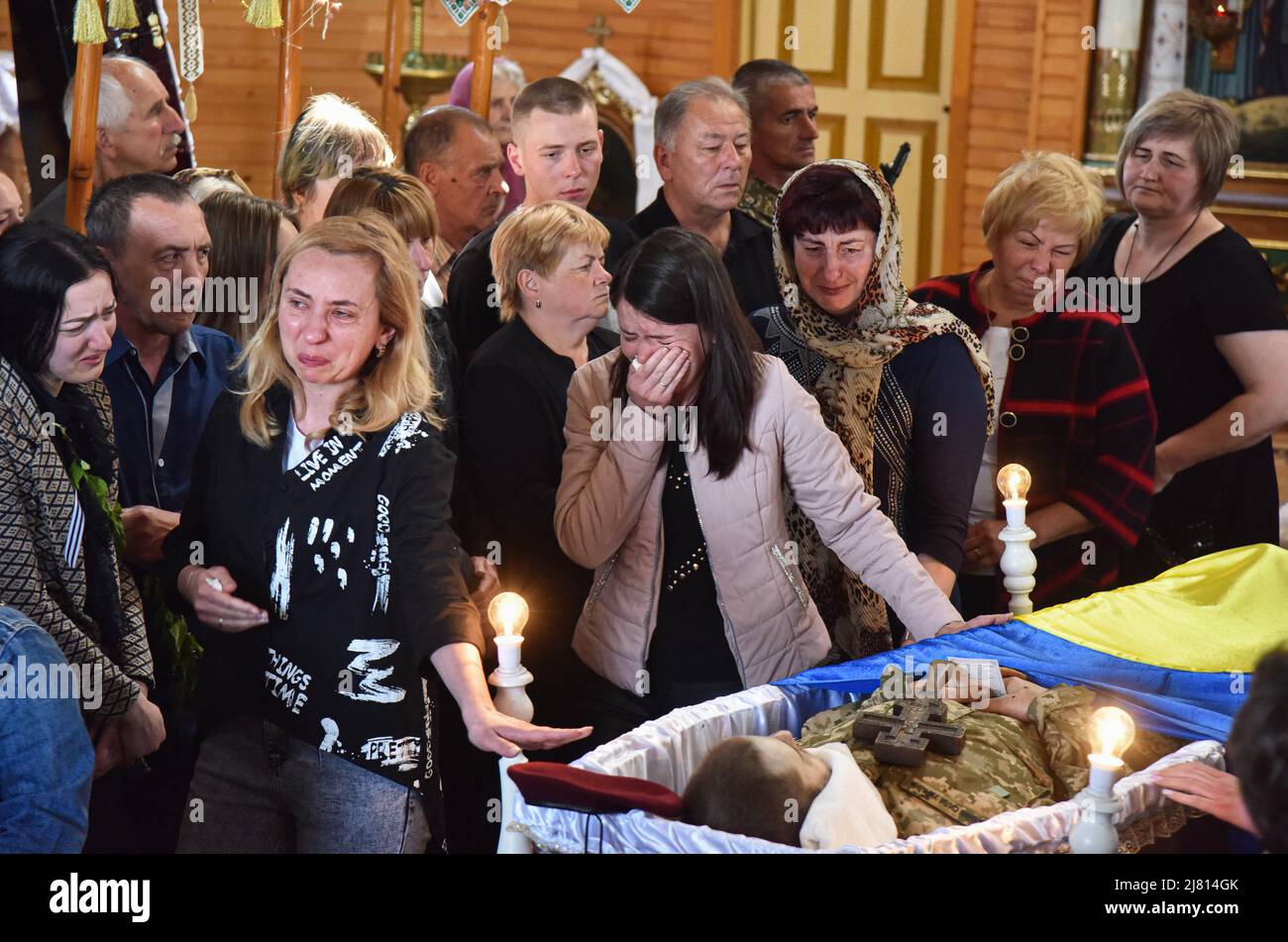 Women seen crying in a church at the village of Kulchytsia, Lviv region ...