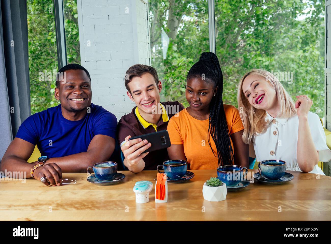 Diverse group drinking tea hi-res stock photography and images - Alamy