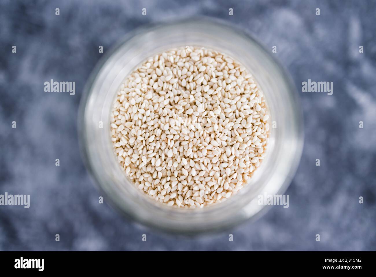 spice jar with sesame seeds close-up shot of pantry ingredients ...