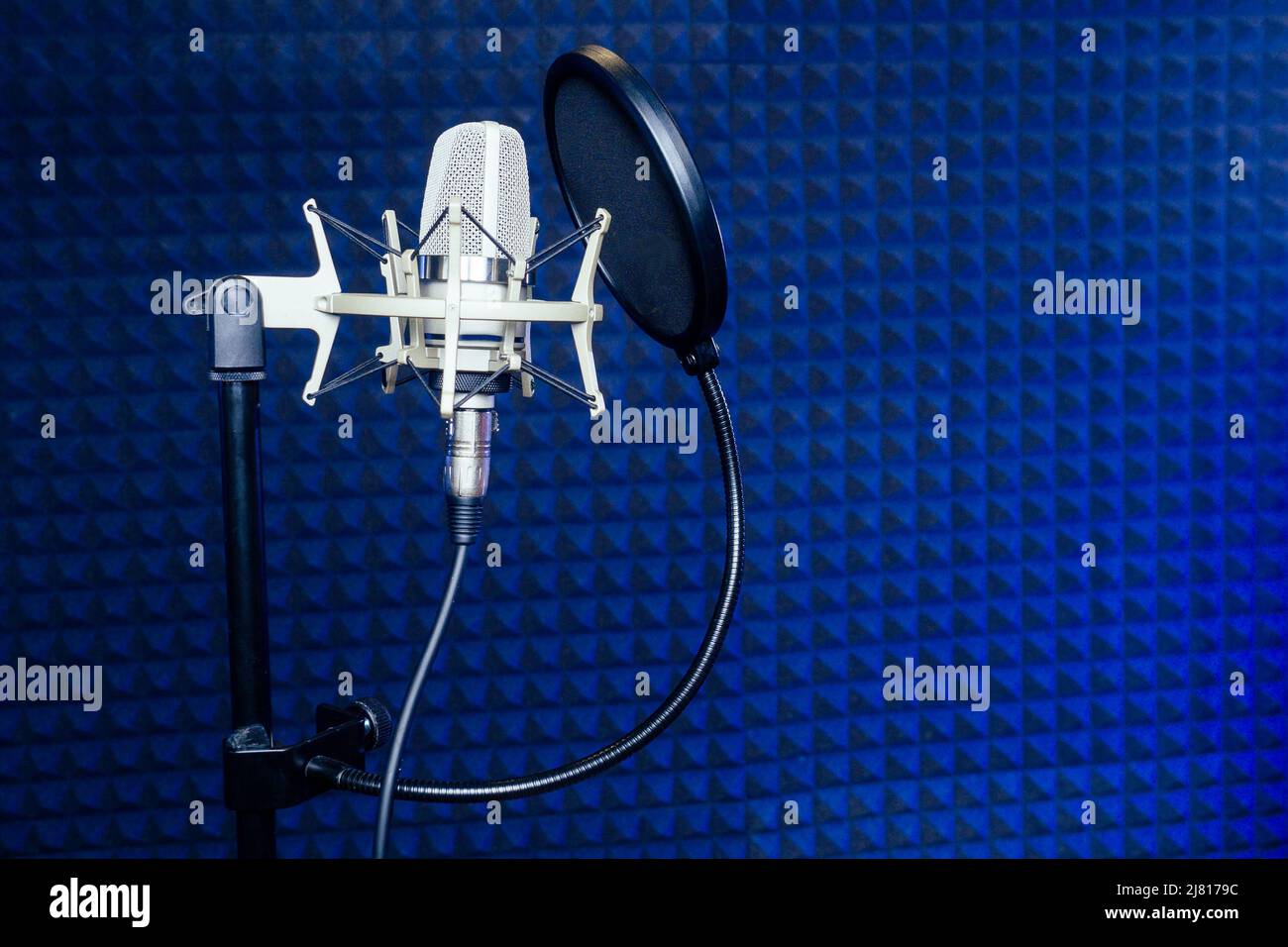 Microphone and headphone in a recording studio soundproof wall Stock ...