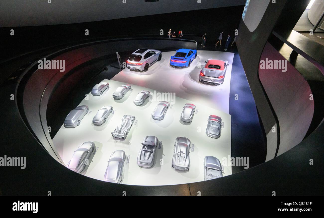 Wolfsburg, Germany. 11th May, 2022. Cars and models from Porsche are on ...