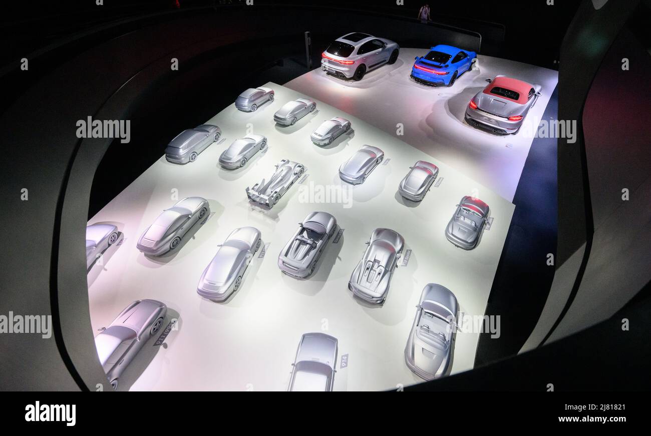 Wolfsburg, Germany. 11th May, 2022. Cars and models from Porsche are on ...