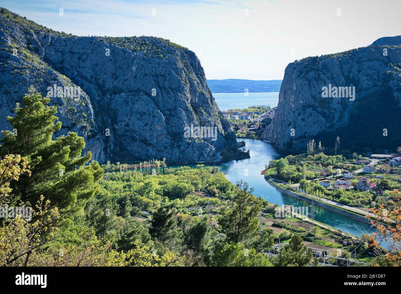 Deep gorge where the river flows into sea with townscape of Omis ...