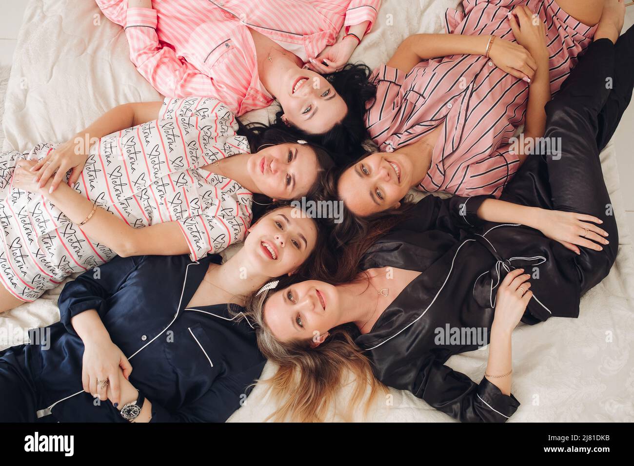 Beautiful ladies enjoying party and showing their tongues Stock Photo ...