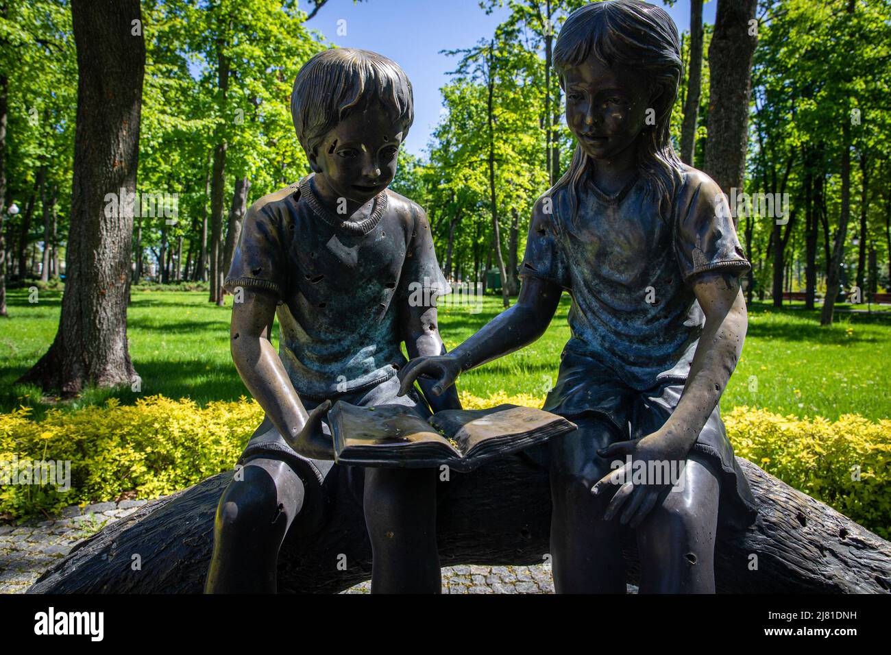 Kharkiv, Ukraine. 06th May, 2022. A statue of children damaged by ...