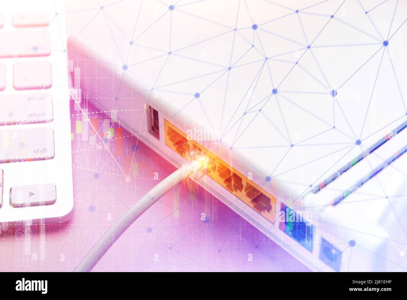 Wi-fi router with internet cable and computer keyboard on pink ...