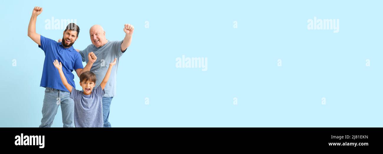Happy man, his father and son on light blue background with space for ...