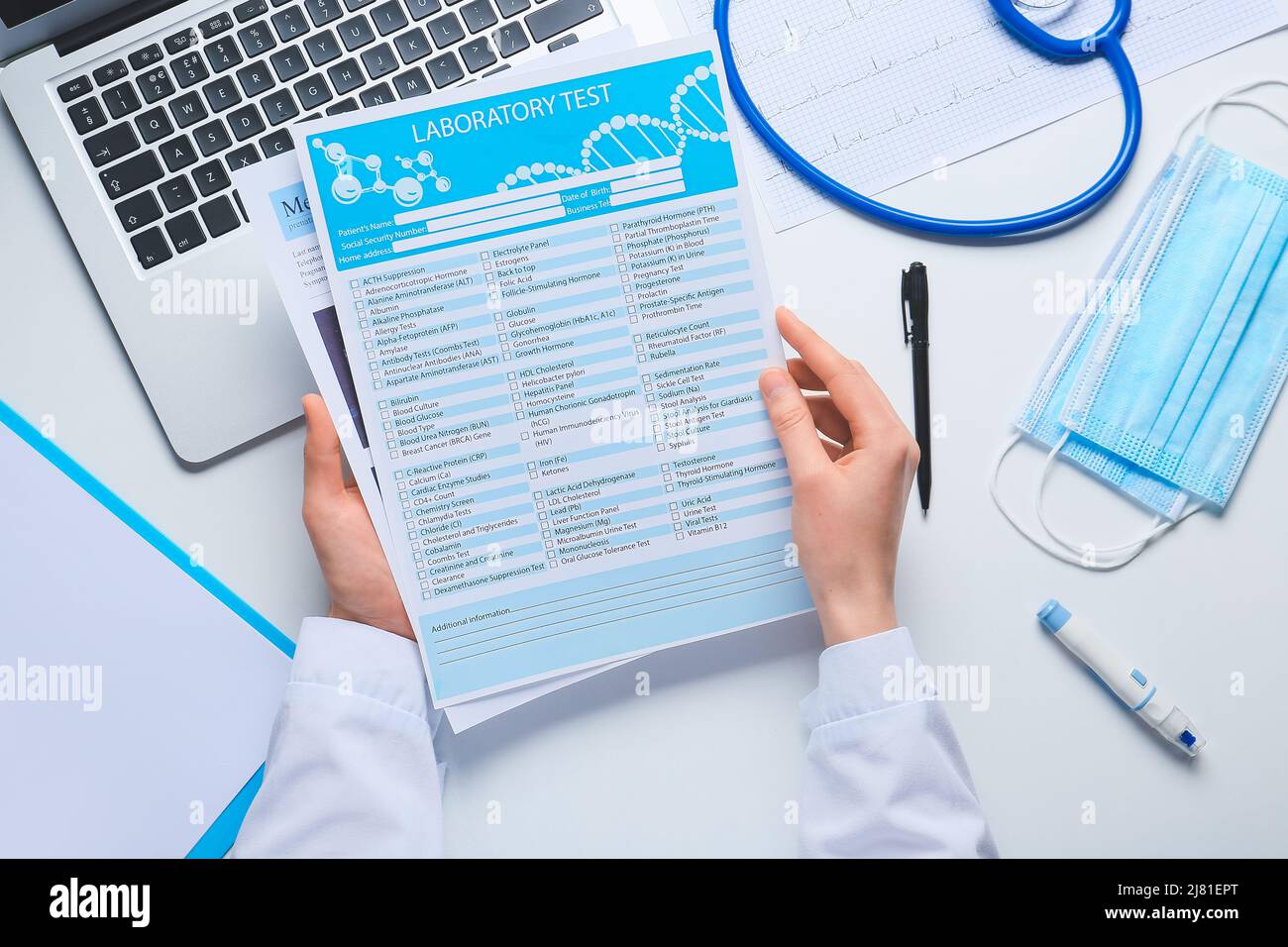 Female doctor holding laboratory test form on white background Stock ...