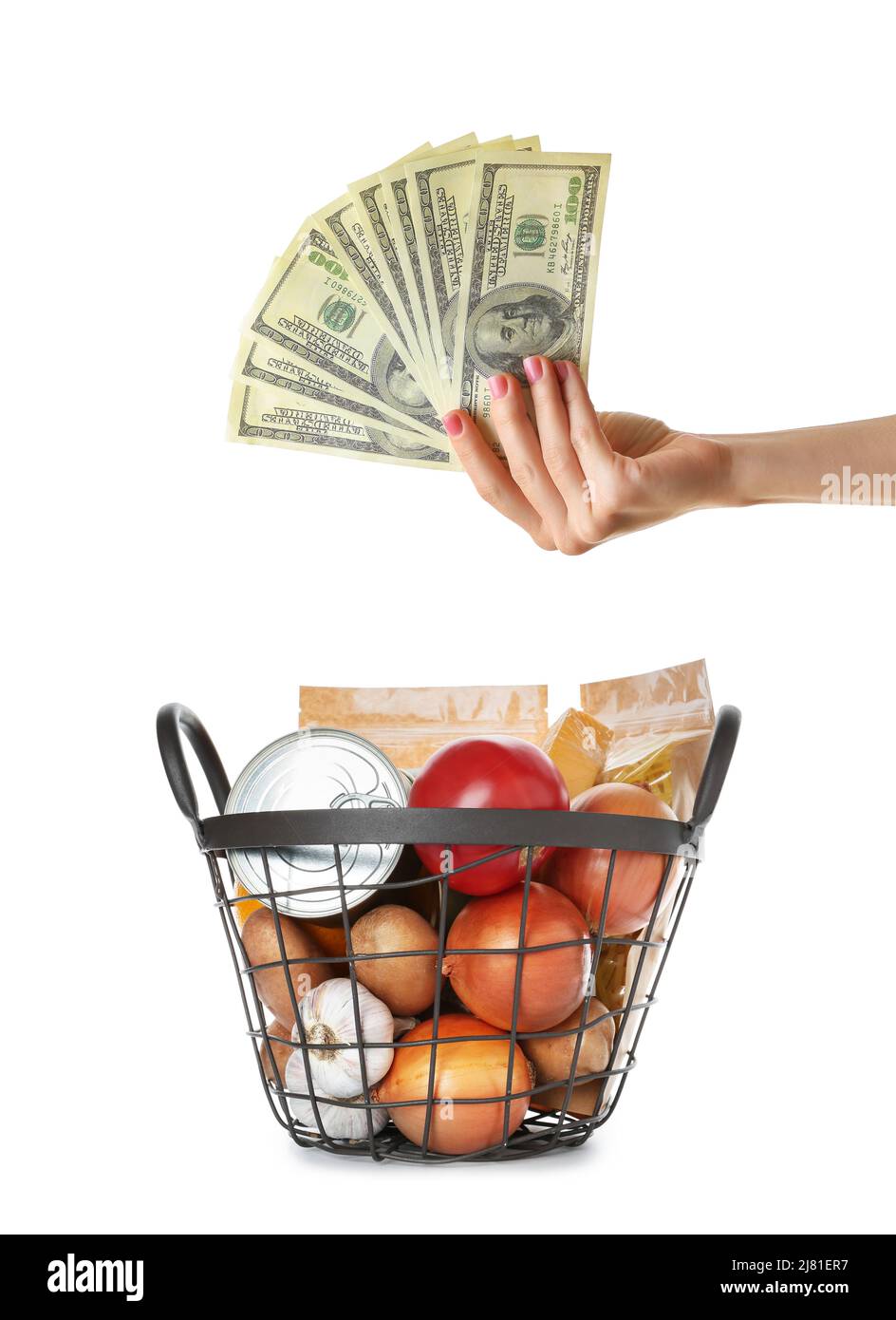 Shopping basket with products and hand holding money on white ...