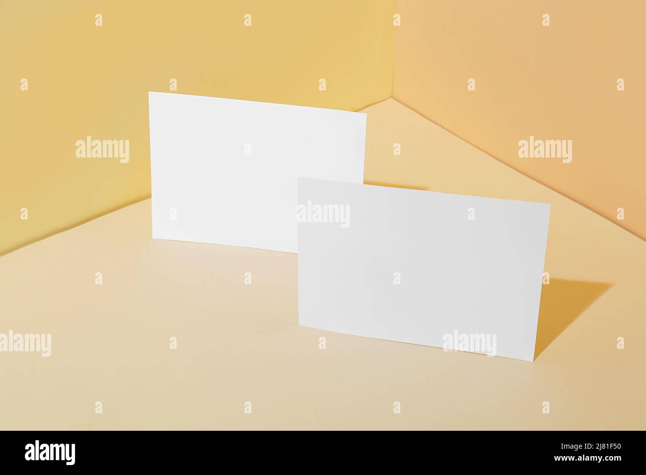 Two empty sheets of paper on color background Stock Photo - Alamy