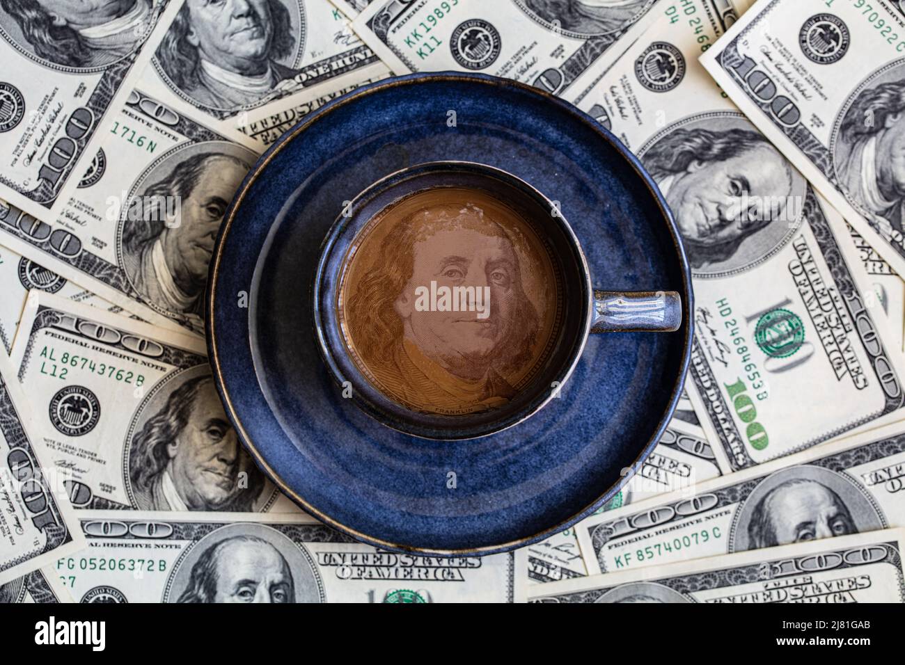 Benjamin Franklin from 100 dollar banknote in a cup of coffee for ...