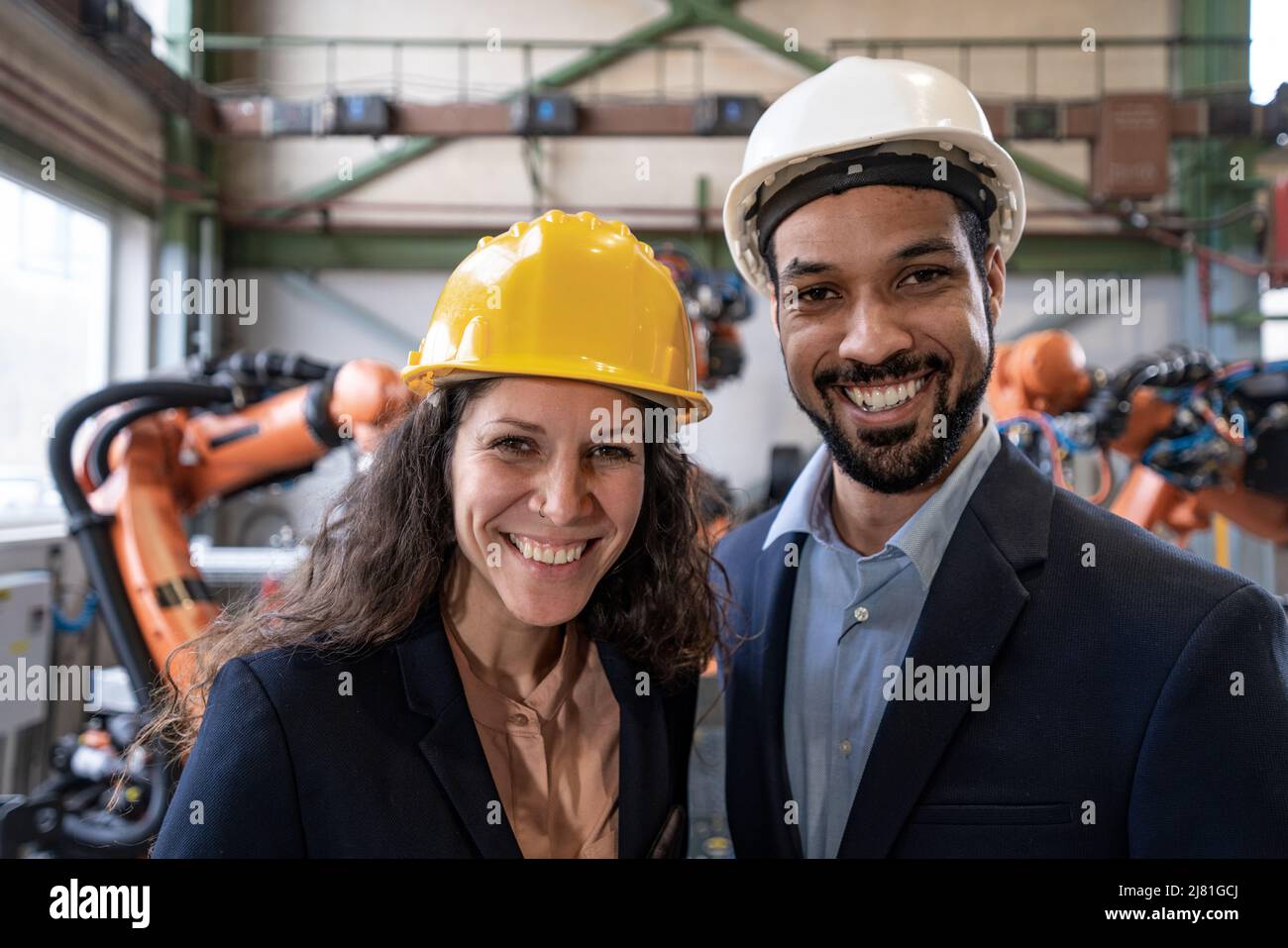 Chief engineer and project manager in modern industrial factory with ...