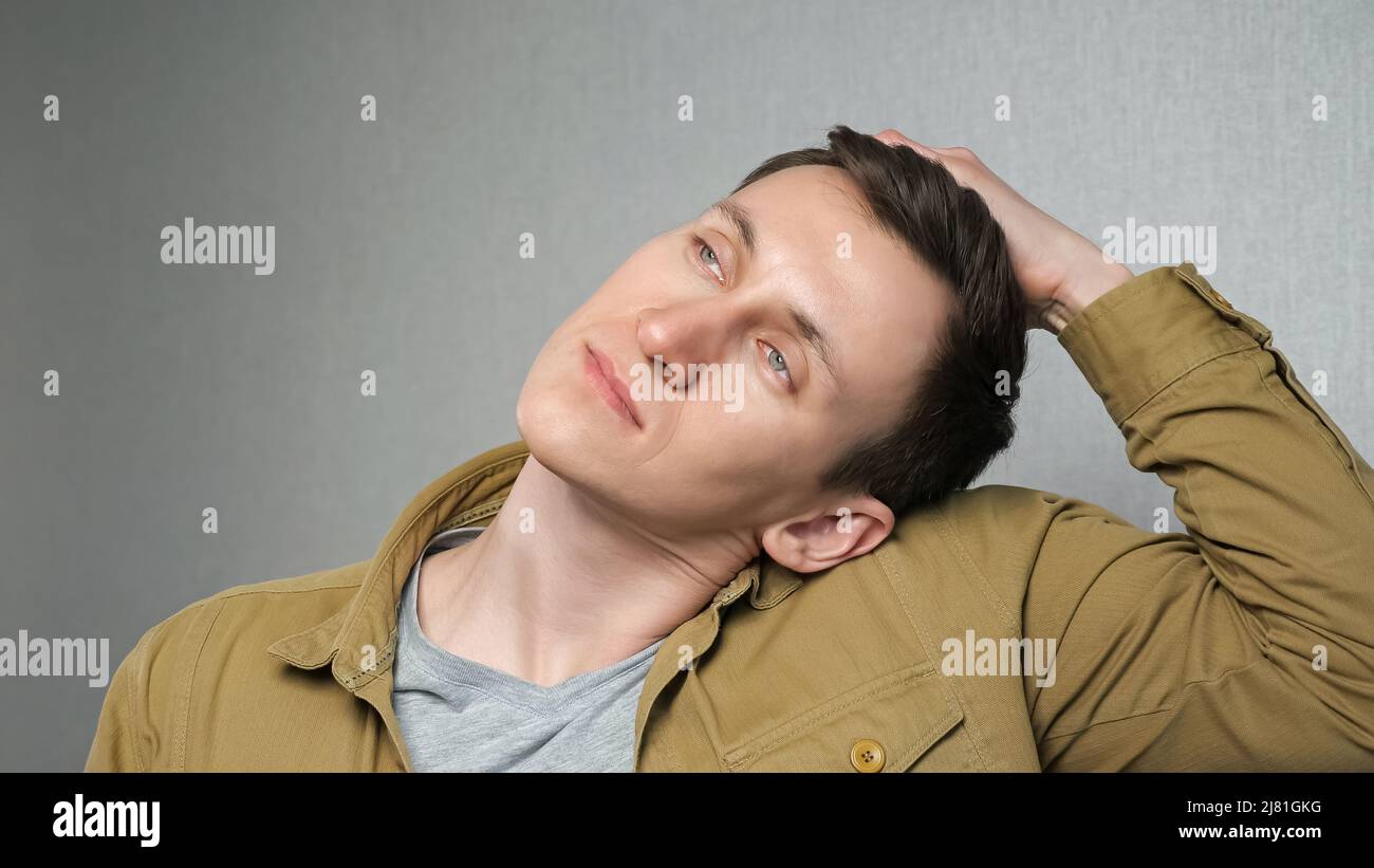 Man tilting his head hi-res stock photography and images - Alamy