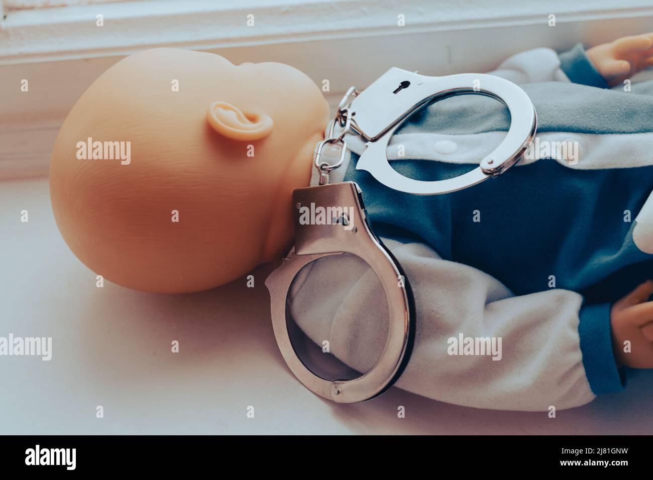 Child handcuffs hi-res stock photography and images - Alamy