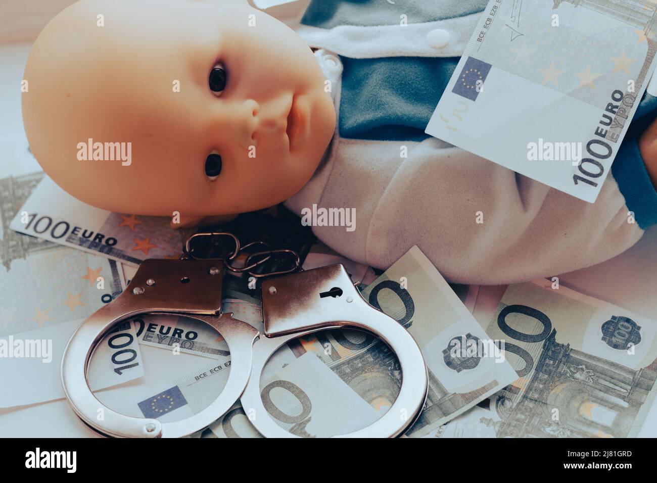 baby doll lies with handcuffs. child crime concept. High quality photo ...