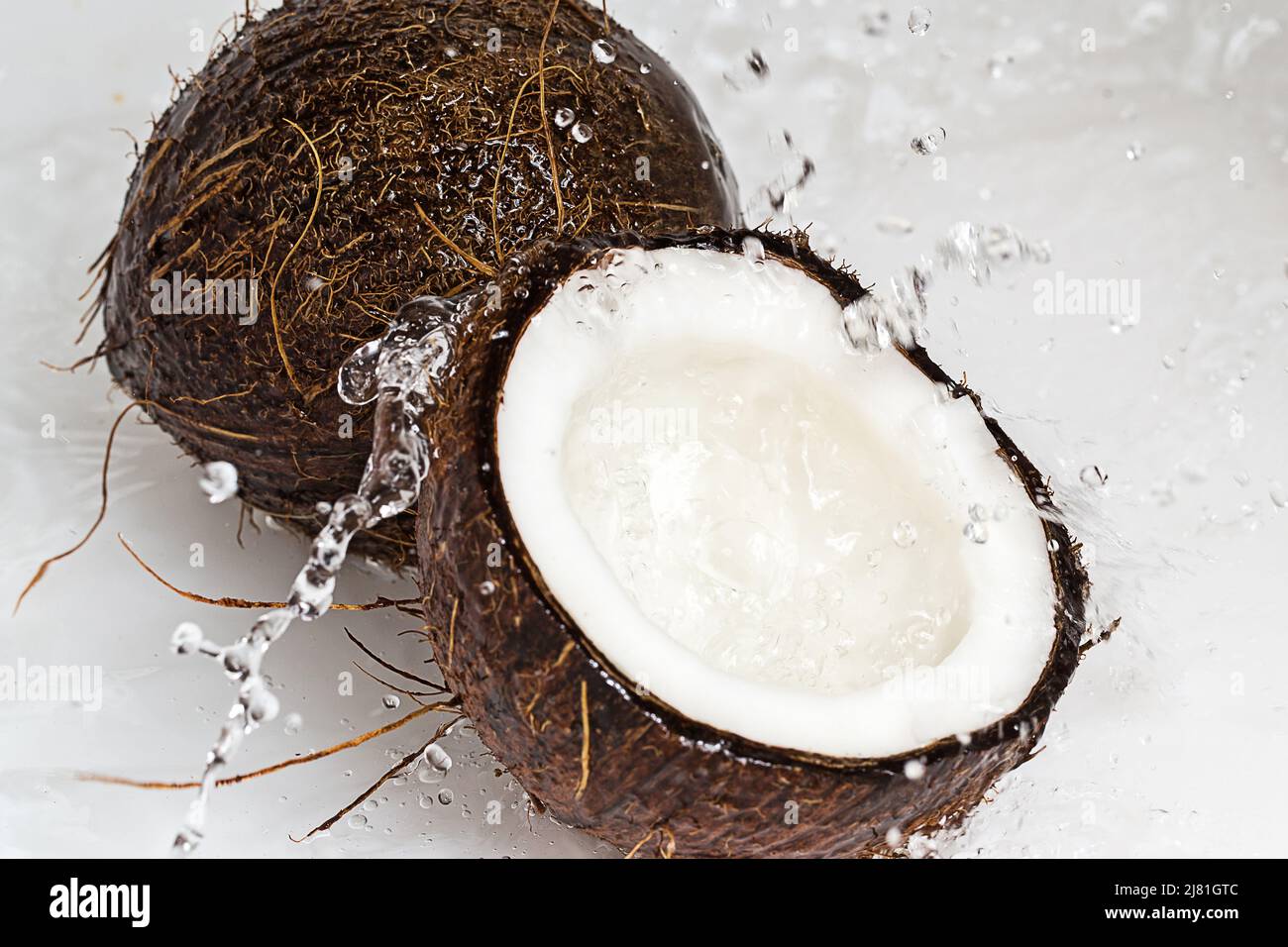 Wet fresh coconuts water hi-res stock photography and images - Alamy
