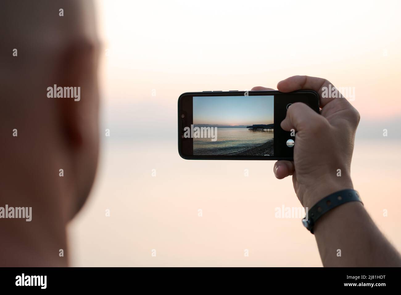 Man taking photo amazing sunset using smartphone camera, tourist hand ...