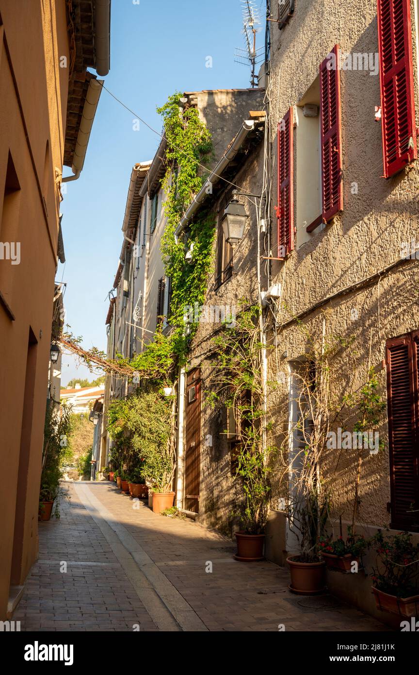 Sunny day in South of France, walking in ancient Provencal coastal town ...
