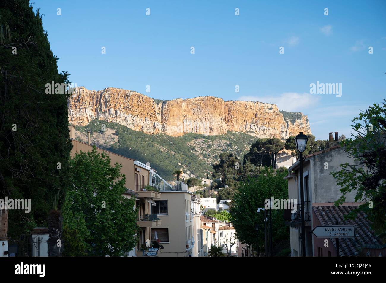 Sunny day in April in South of France, narrow streets and colorful ...