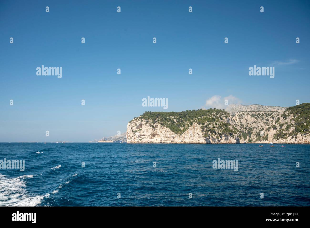Limestone cliffs and blue sea near Cassis, boat excursion to Calanques ...