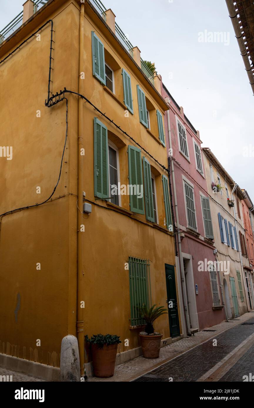 Rainy day in April in South of France, narrow streets and colorful ...