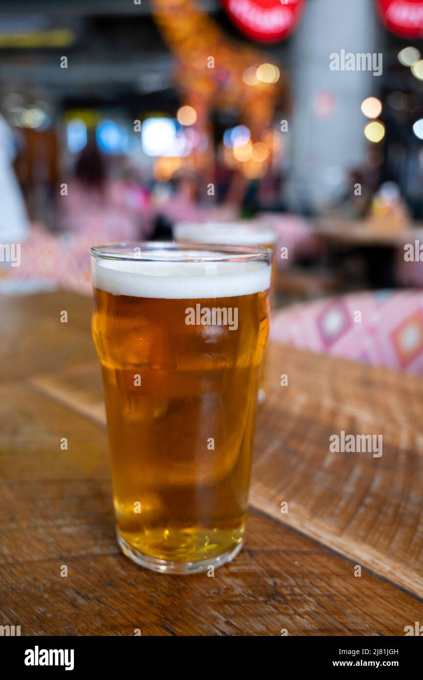 Fresh draught lager beer is glass served in indoor cafe close up Stock ...