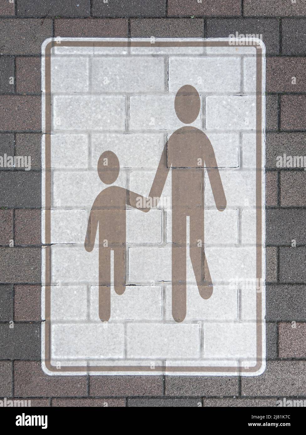 Image of Sign or symbol for pedestrians at the tiled road Stock Photo ...