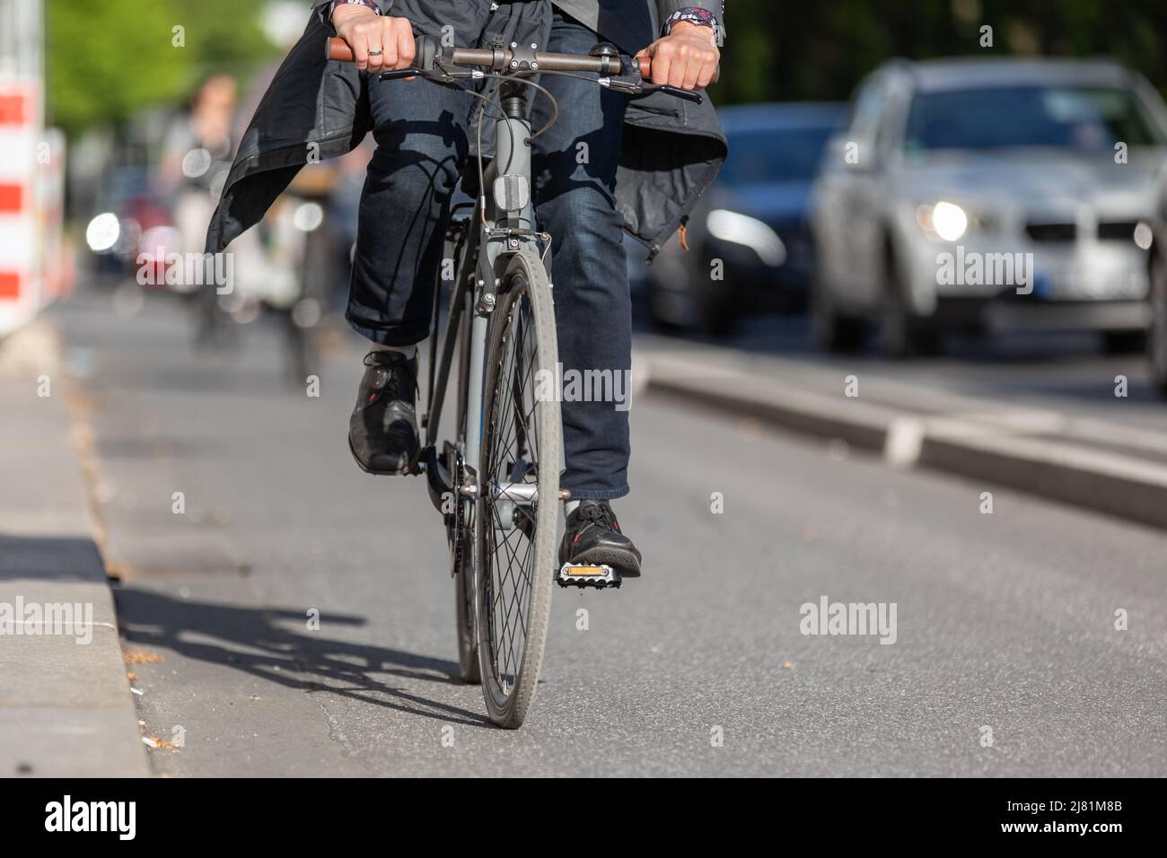 gray bike on protected bike lane Stock Photo - Alamy