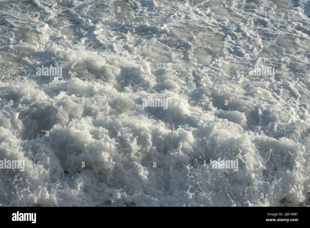 White foam in a rough wave sea Stock Photo - Alamy