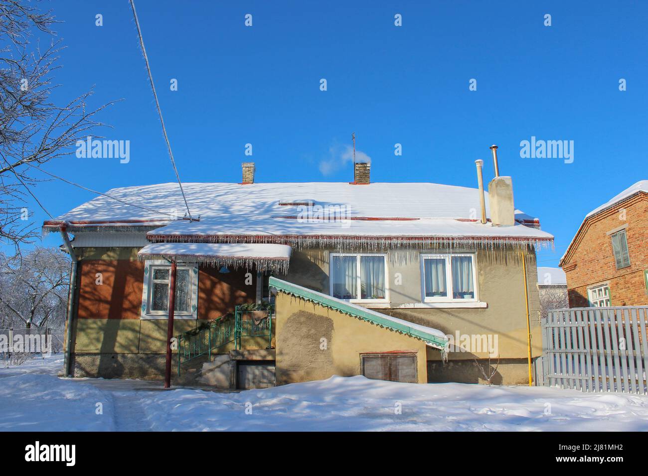 A beautiful winter house in sunny weather Stock Photo - Alamy