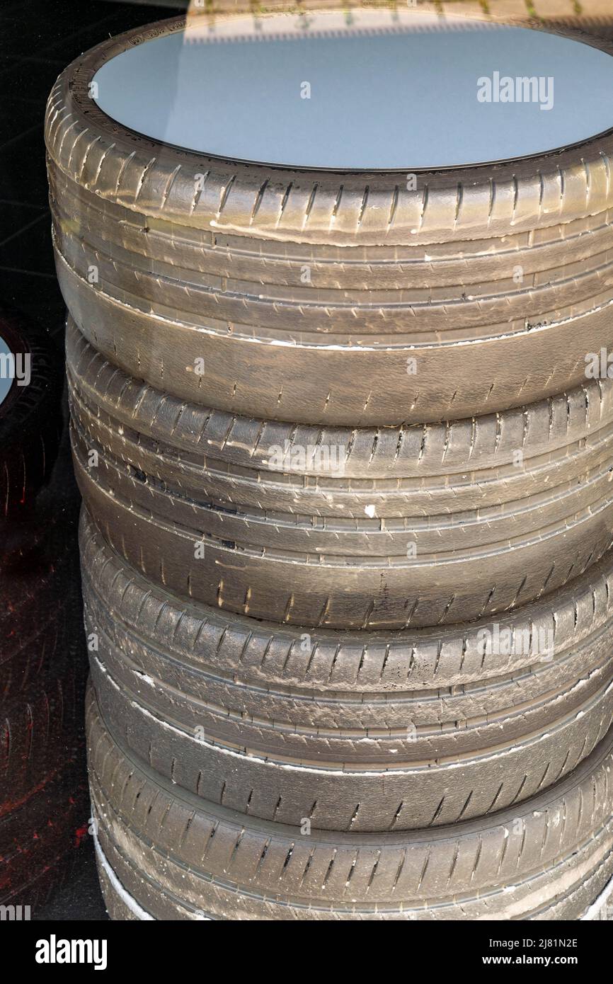 Stack of worn tyres of an upmarket racing car Stock Photo - Alamy