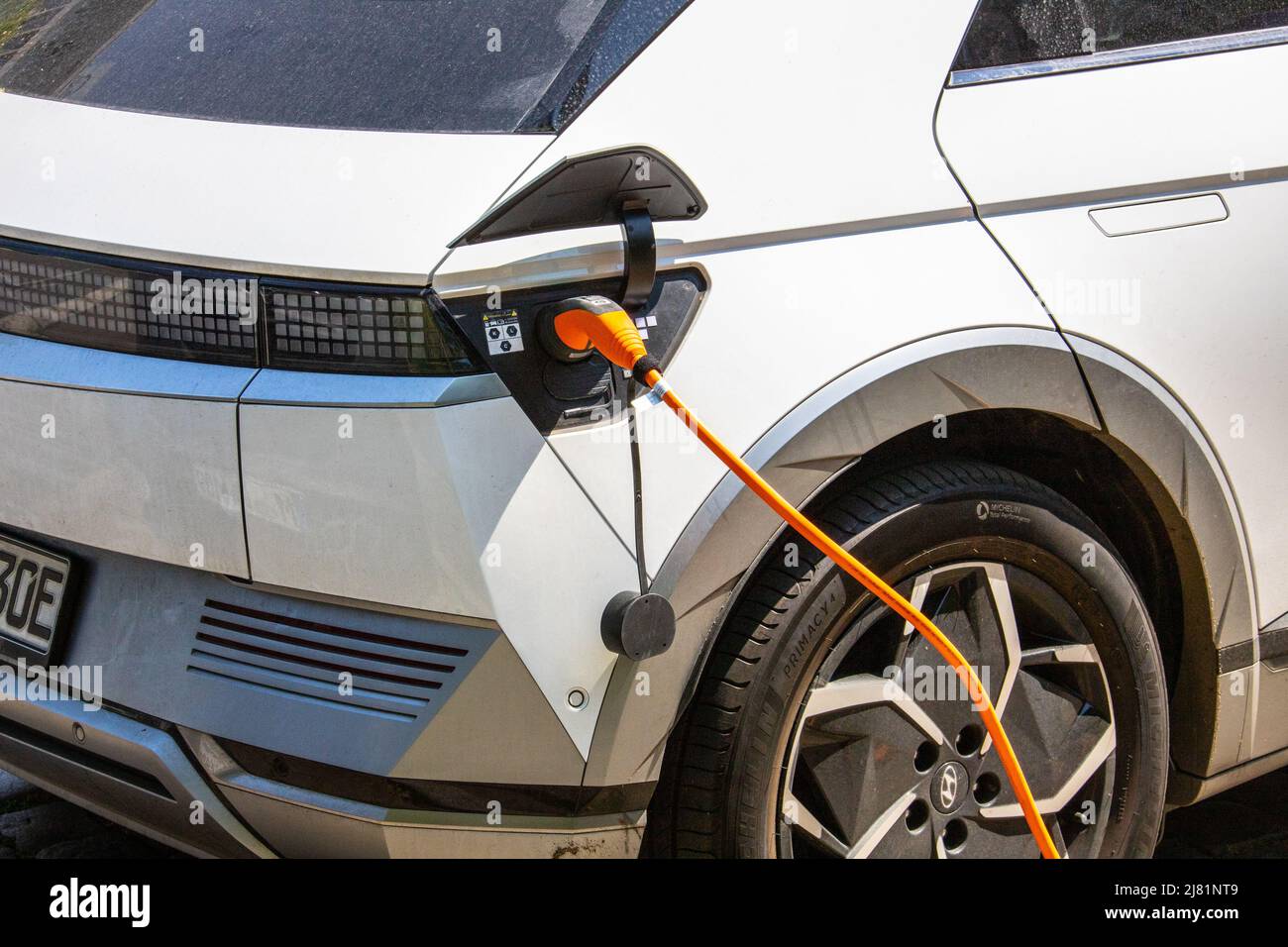 Hyundai Ioniq 5 EV charging on the street in Frankfurt, Germany Stock ...